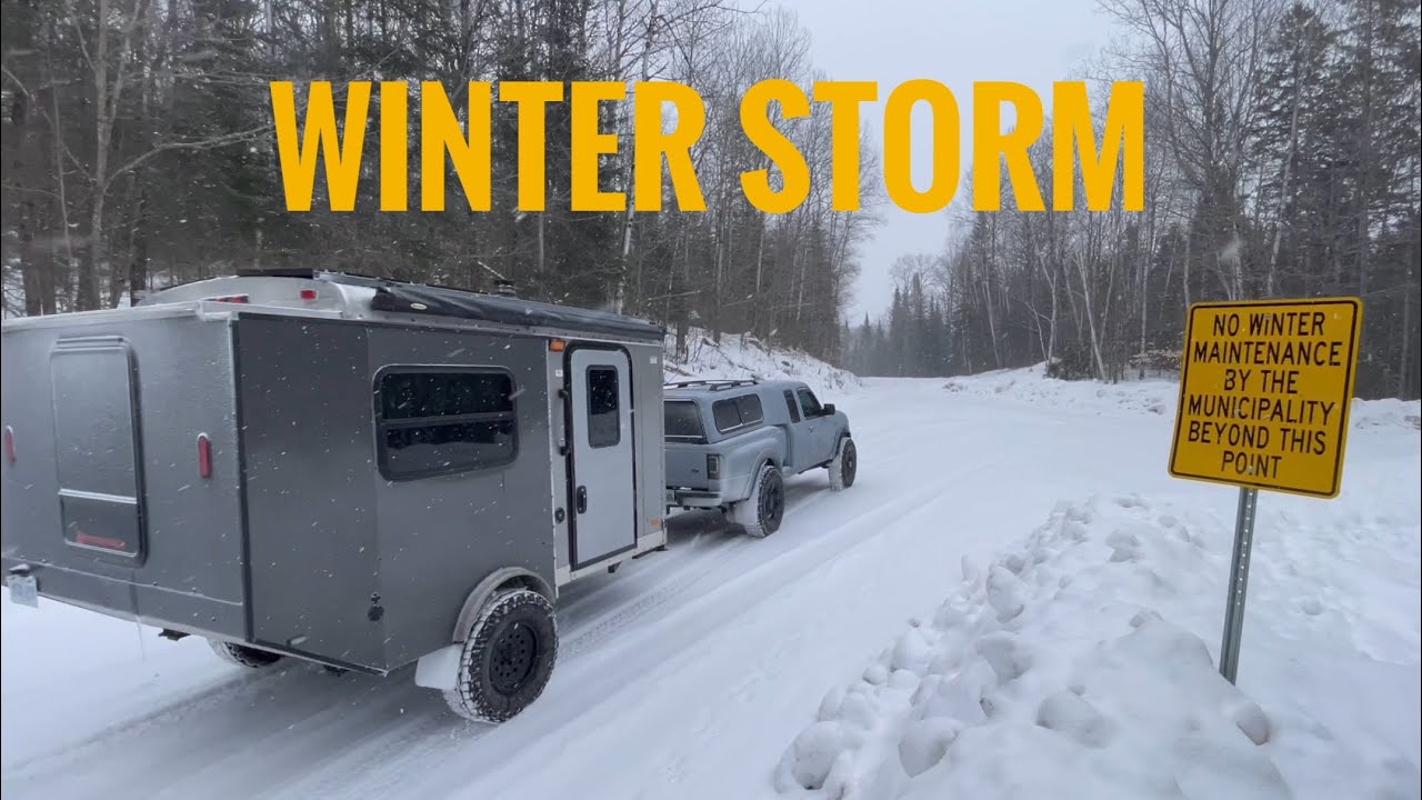 Riding out a winter storm in the tiny cargo trailer PART 1 - YouTube