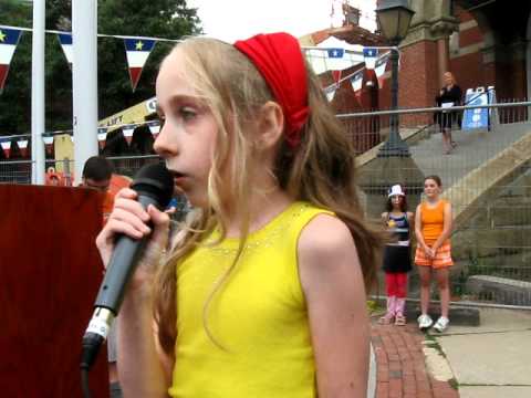 Young Acadian girl singing Ave Maris Stella on Acadian Day in ...