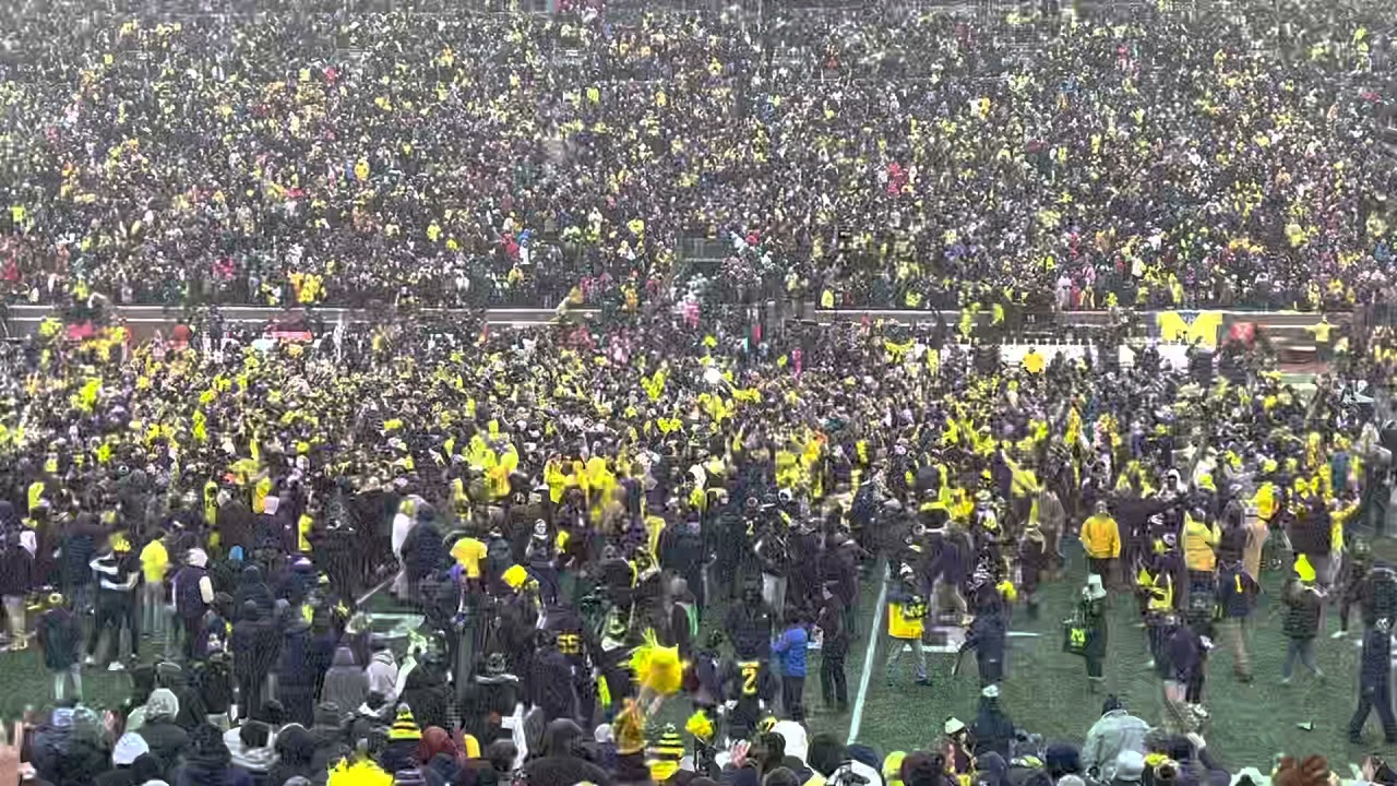Michigan fans rush the field after beating Ohio State - YouTube