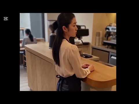 Coffee shop hostess relaxing | Socked foot dipping in sneakers