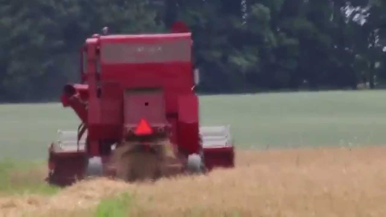 White 7300 with grain head. - YouTube