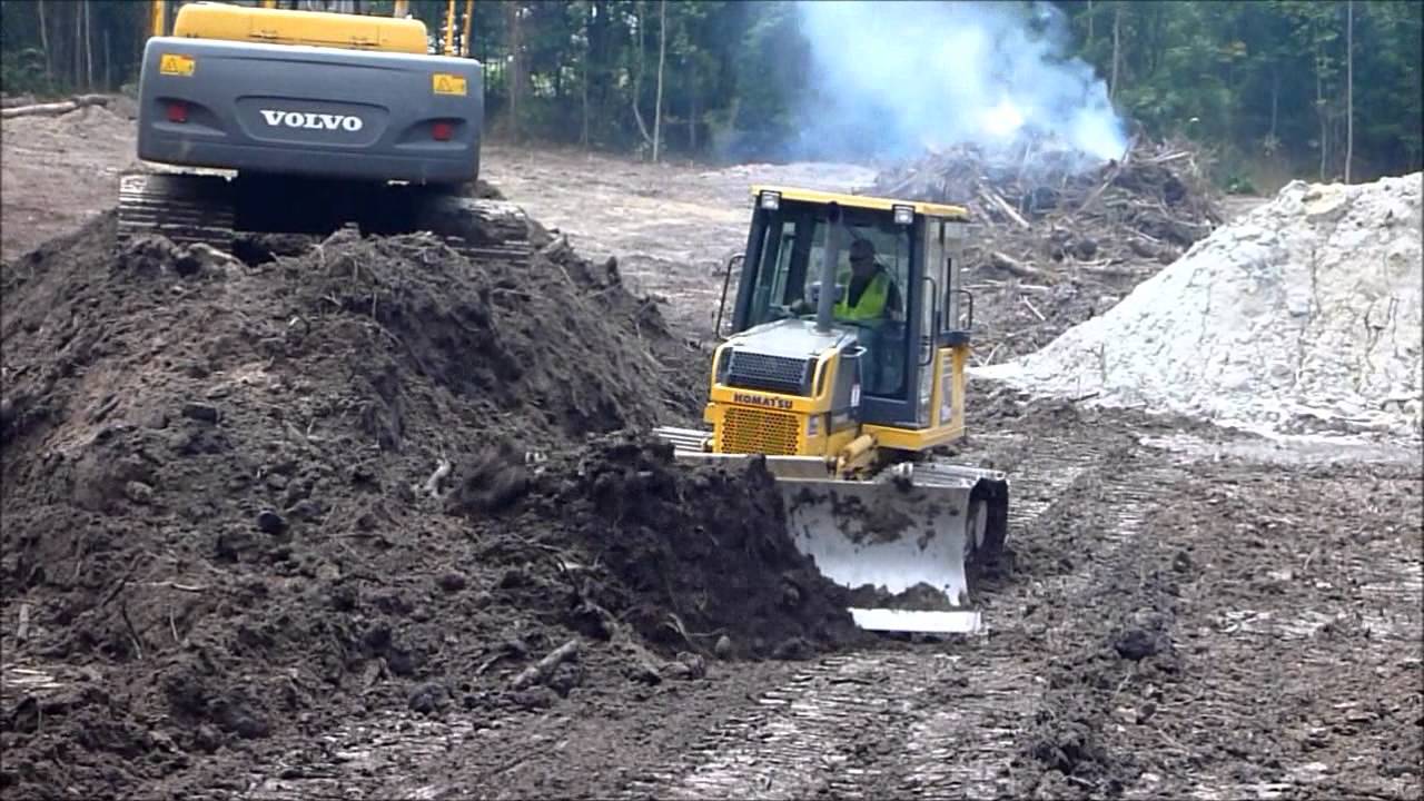 Dozer Pushing Topsoil - YouTube
