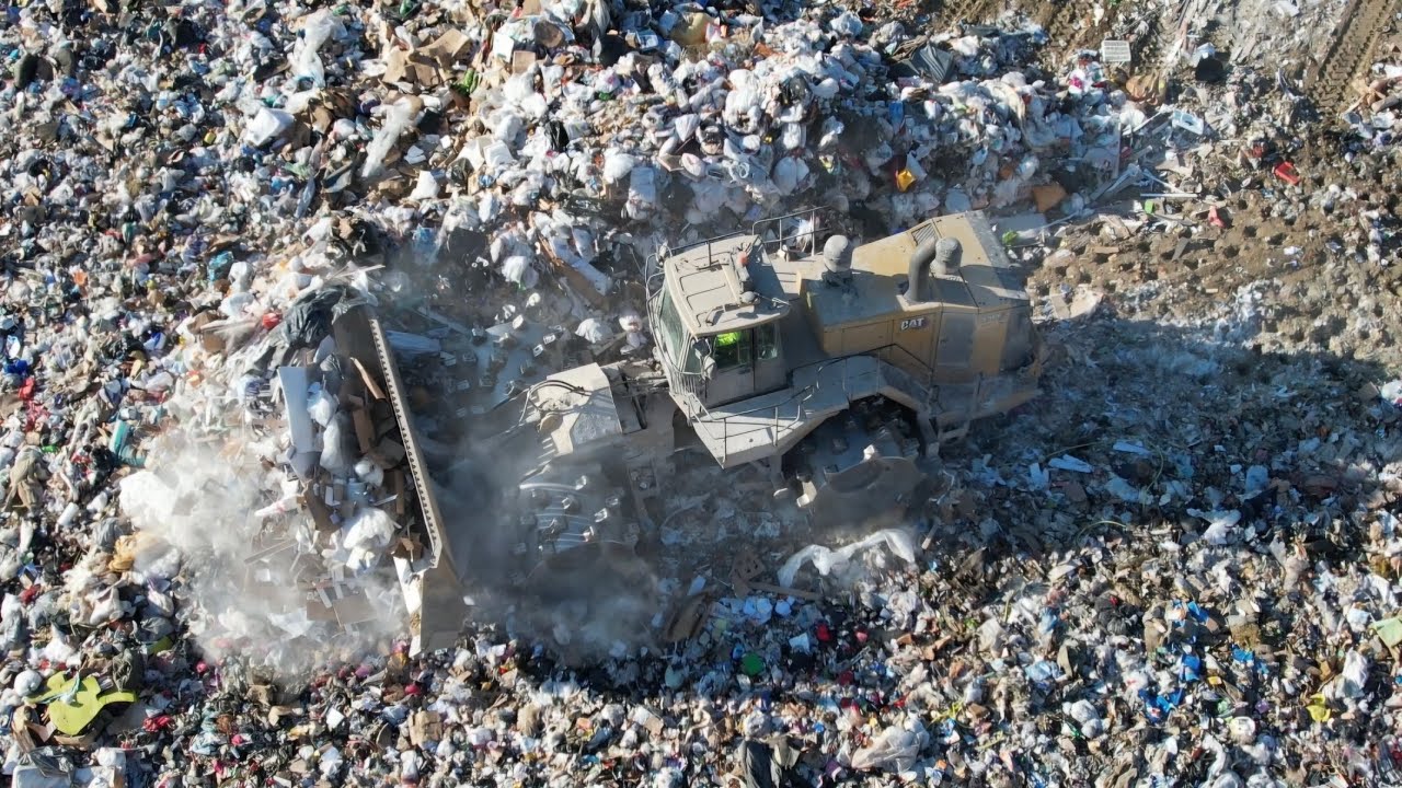 Cat 836K Compactor In Action - YouTube