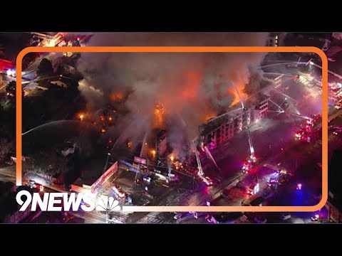 Raw video: Sky9 flies over large fire at Denver construction site