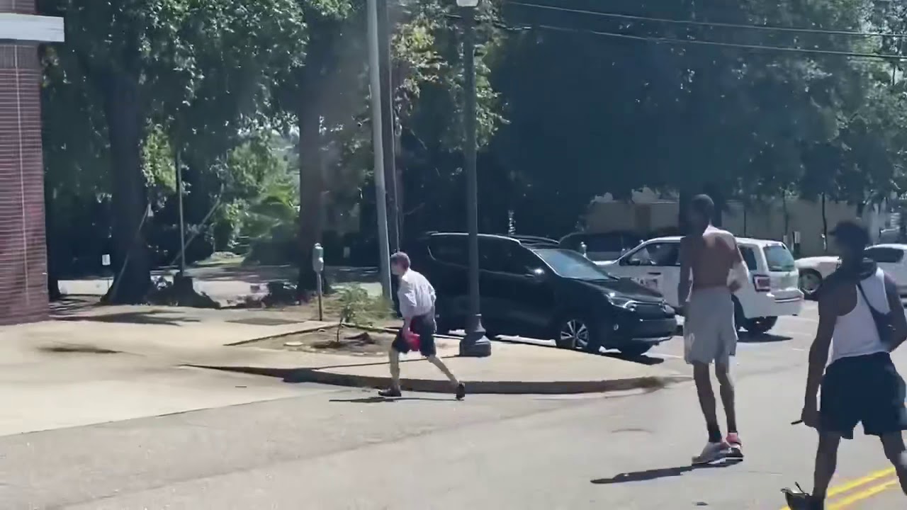 Someone pulled up to the protest wearing one of those famous red hats ...