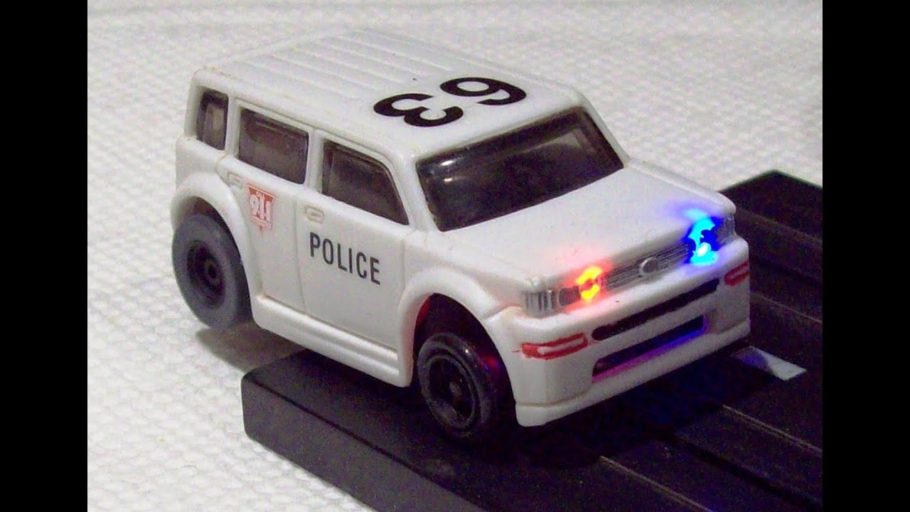 Custom Scion Police AFX HO slot car with flashing LEDs on track - YouTube