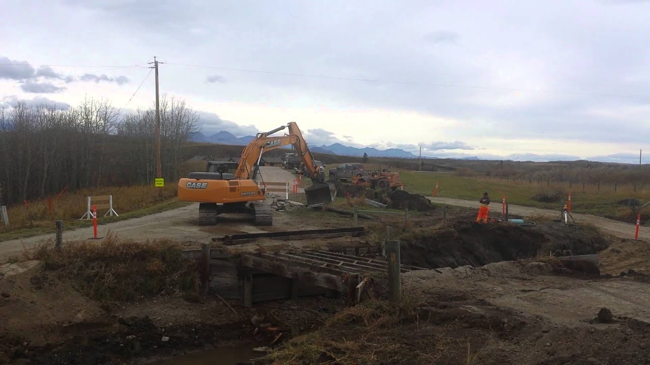 Excavator digging out an old wooden bridge! - YouTube