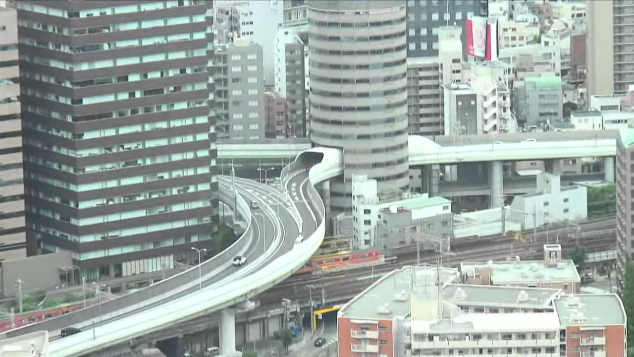Hanshin Expressway going through Gate Tower Building - YouTube