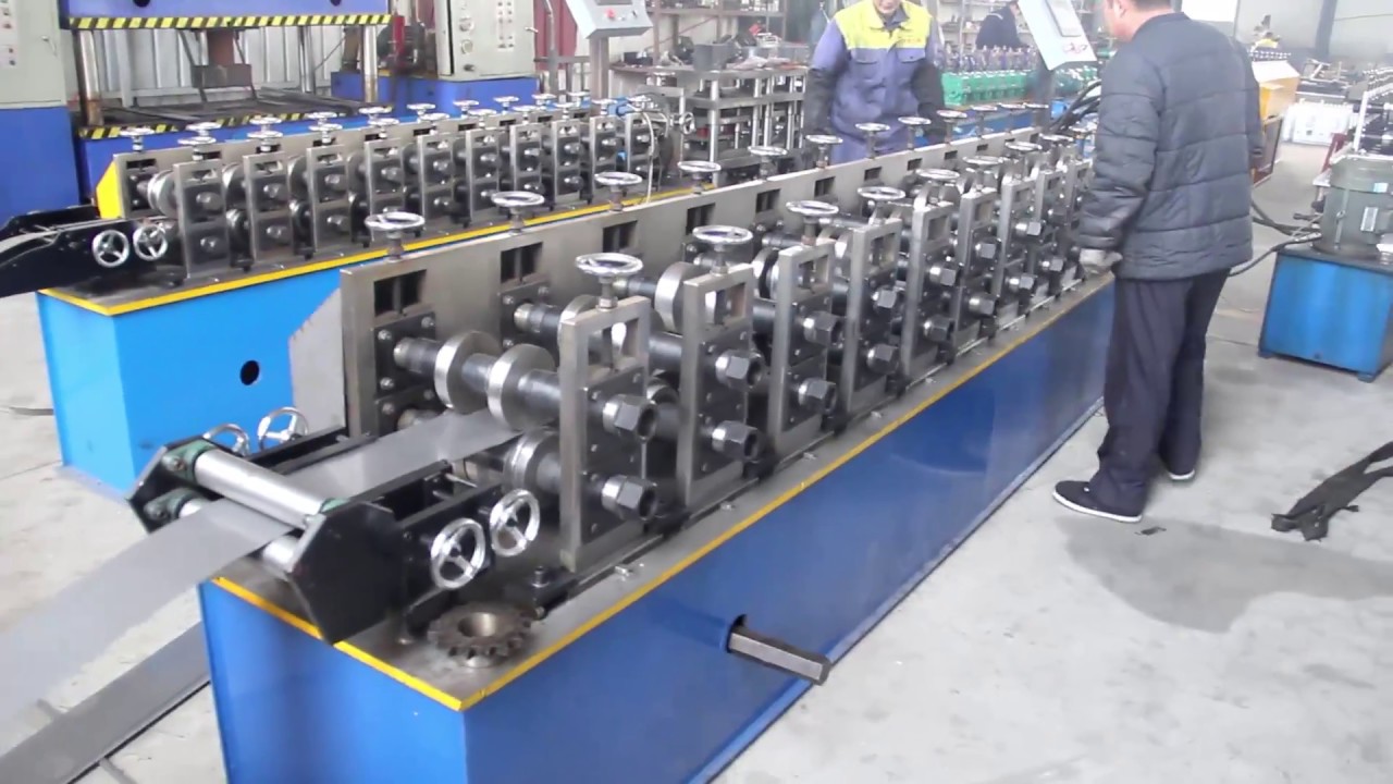 C steel roll forming machine with punching - YouTube
