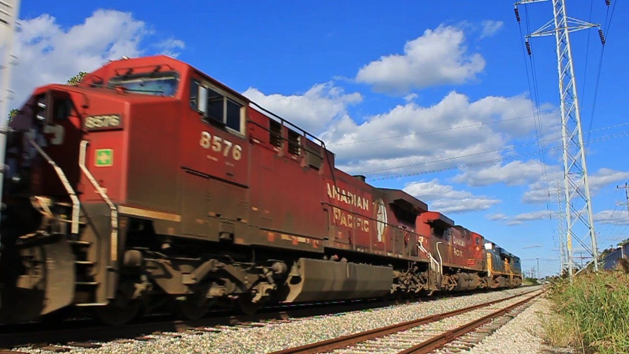 CSX C40-8W, ES40DC, & a pair of CP AC44CW's head east on the Detroit ...