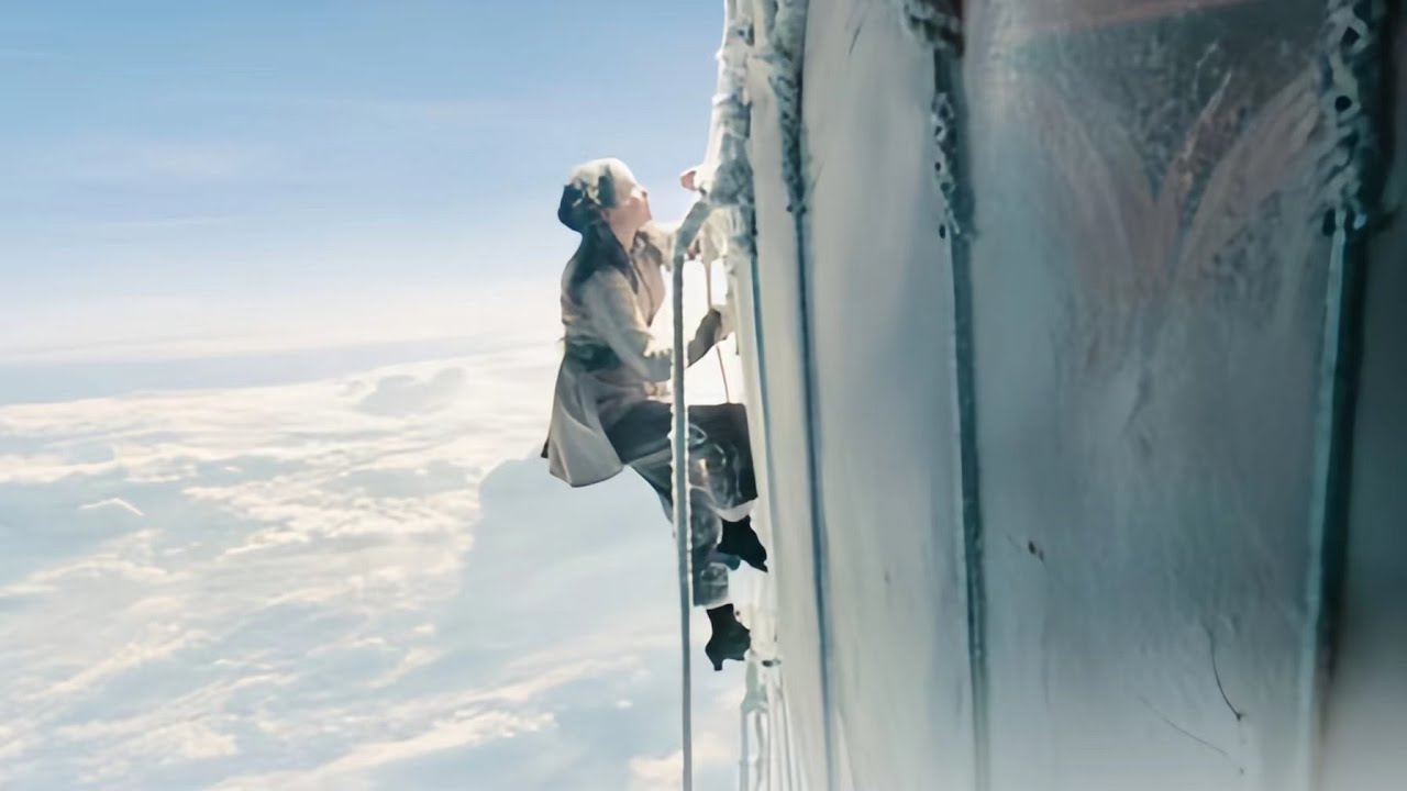 The girl is climbing a hot air balloon with her bare hands at an ...