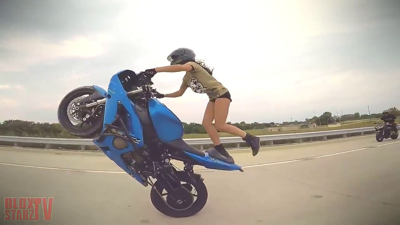 Crazy girl does motorcycle stunts - YouTube