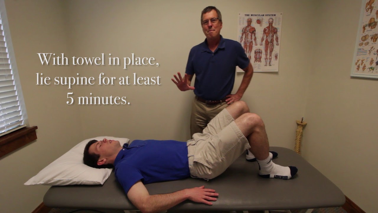 Self Mobilization of the Sacrum with a Towel - YouTube