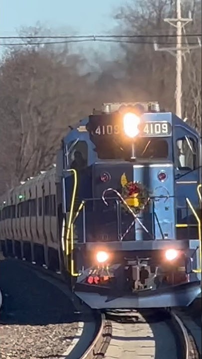 NJT 4109 CNJ and NJT 4101 NJDOT lead the NJT Christmas train through Denville station NJ 12/10 ...