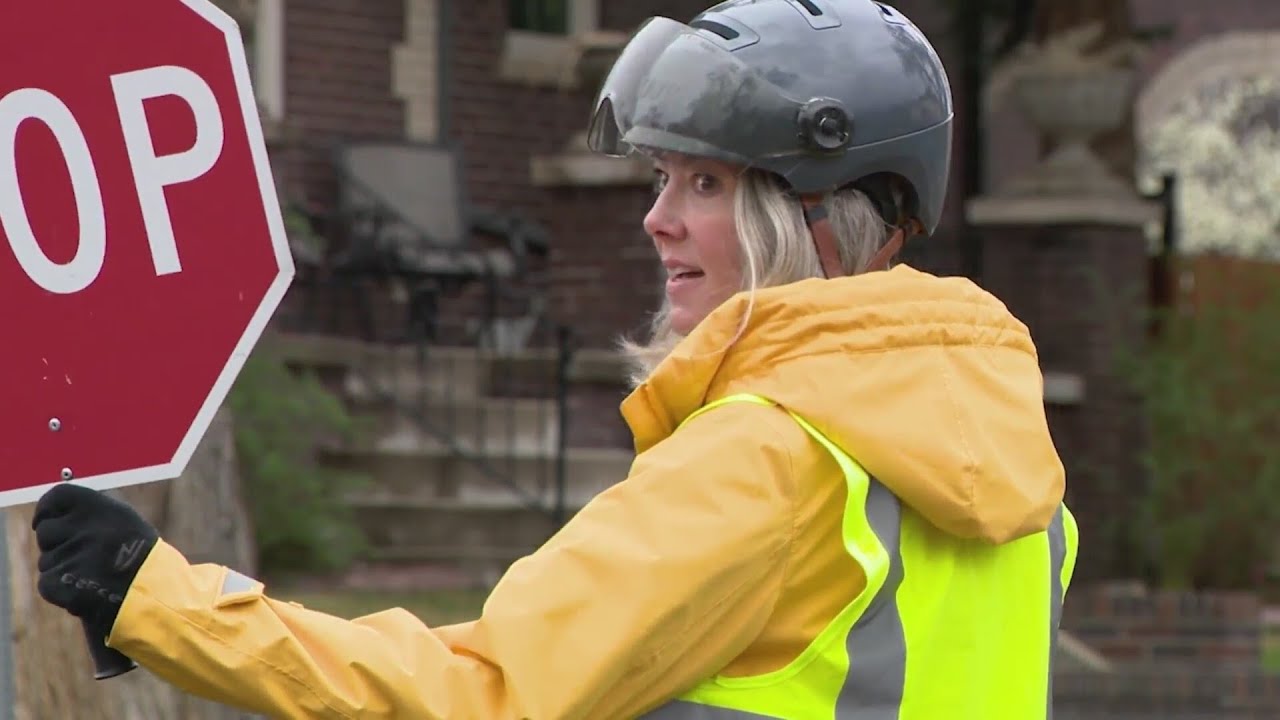 Denver crossing guard goes viral with safety methods - YouTube