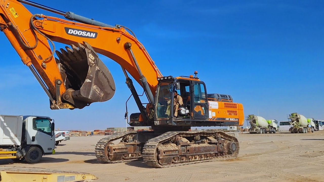 doosan DX520 LCA excavator loading - YouTube