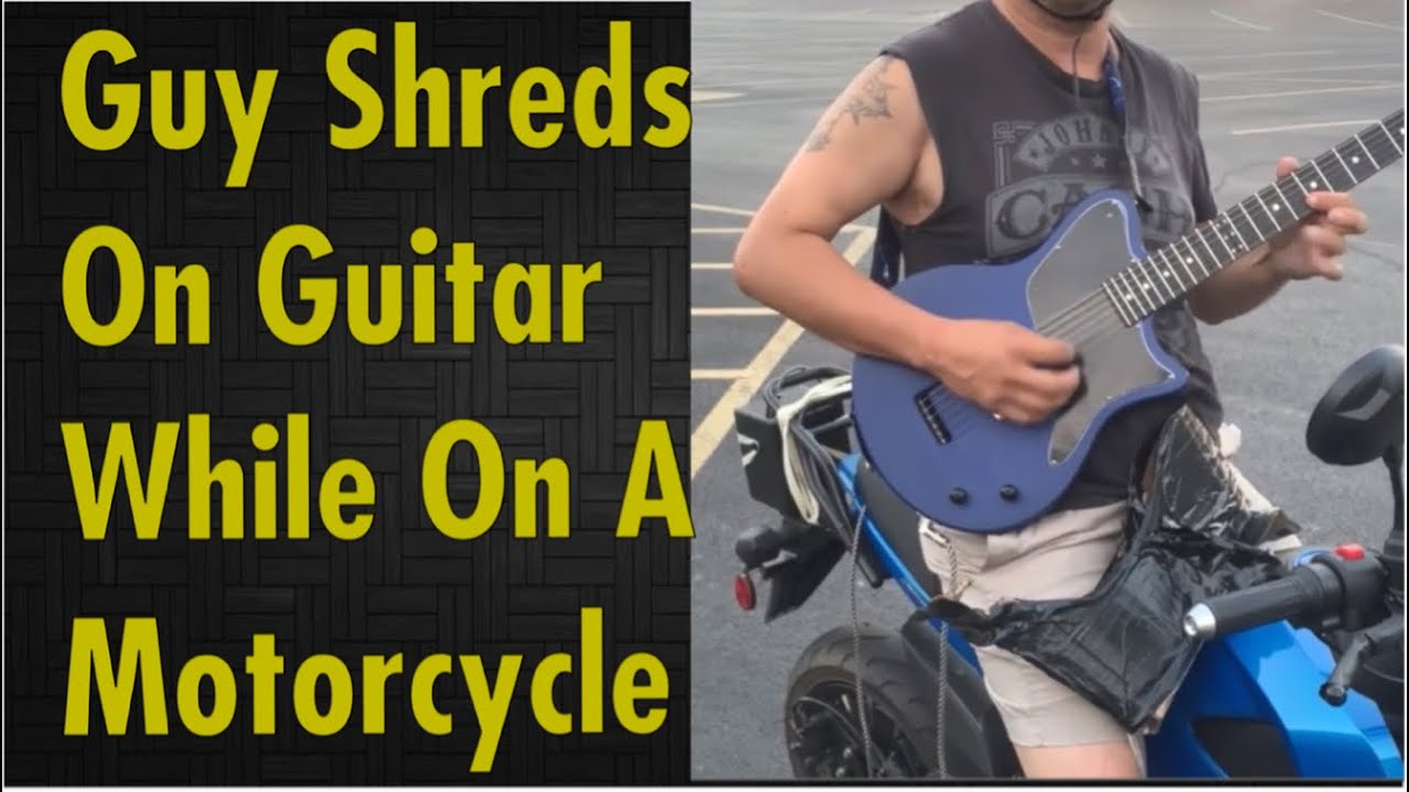 Guy plays a guitar while on a motorcycle - YouTube