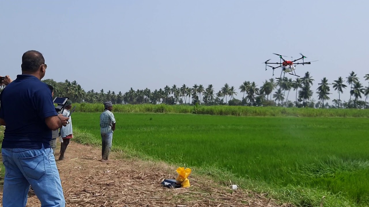 TASS AGRICULTURE DRONE PADDY SPRAYING - YouTube