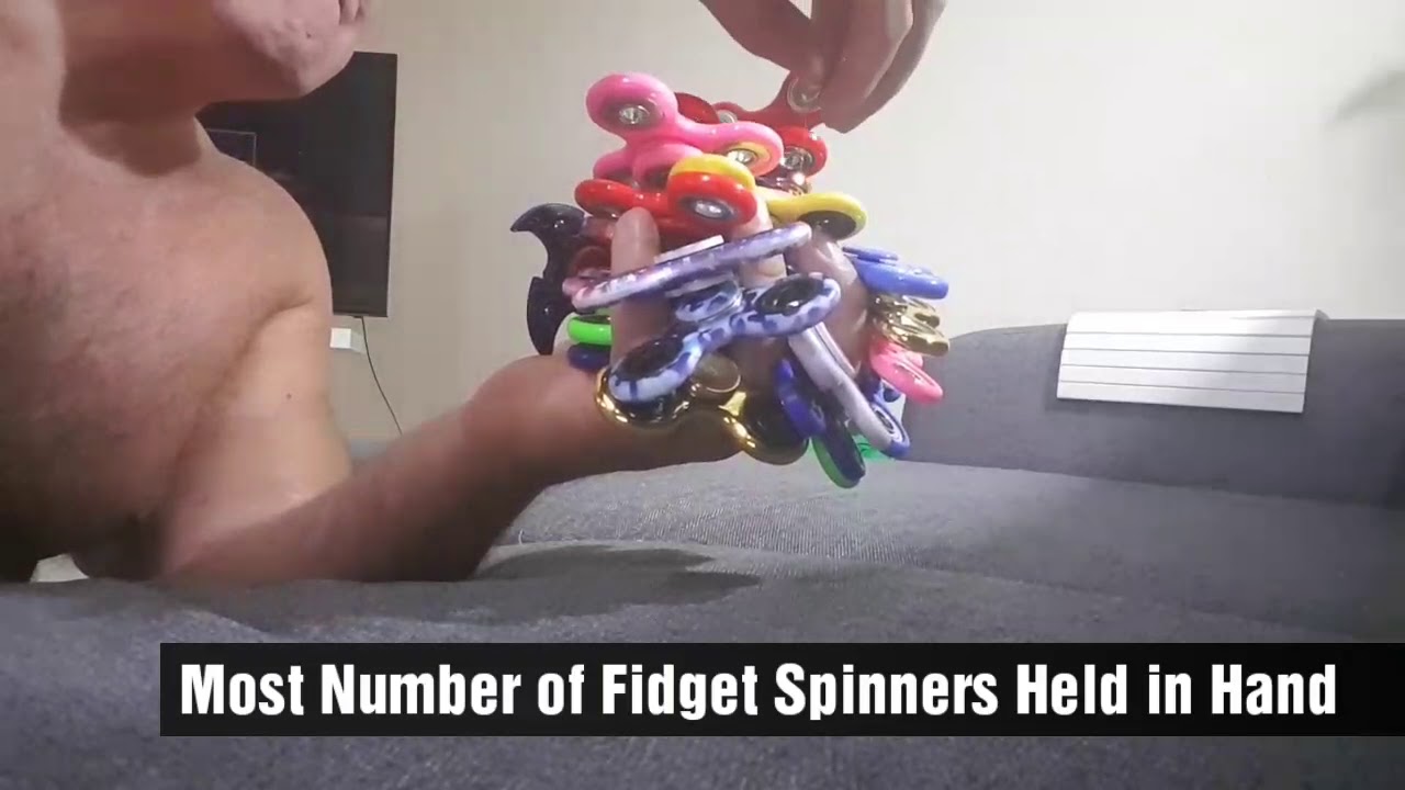 World Record: Most Fidget Spinners in hand! - YouTube