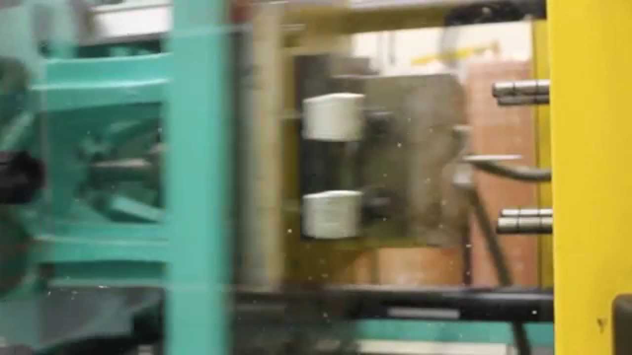 A 50T Arburg with a robot sprue picker (close up version). - YouTube