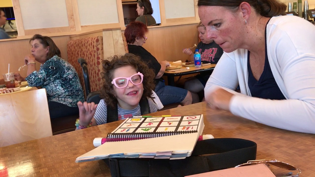 Mom modeling PODD while out to eat. - YouTube
