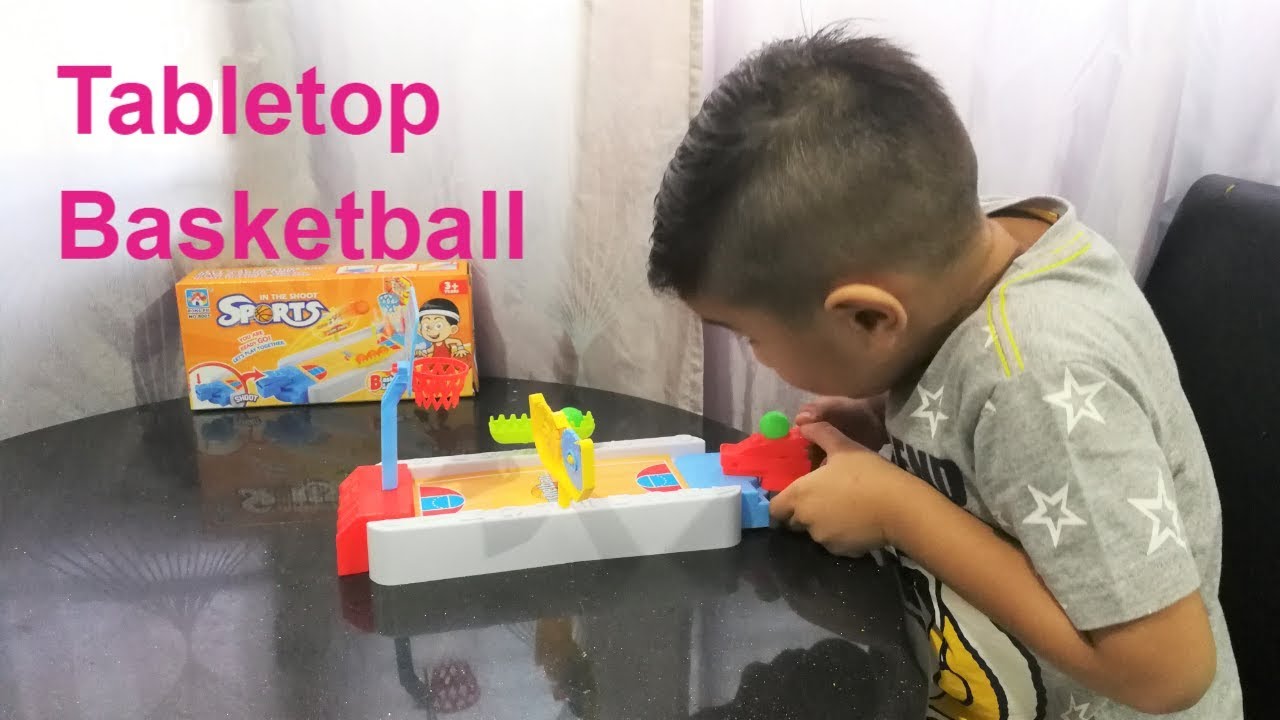Kid playing mini basketball table top game | Mini basketball table game ...