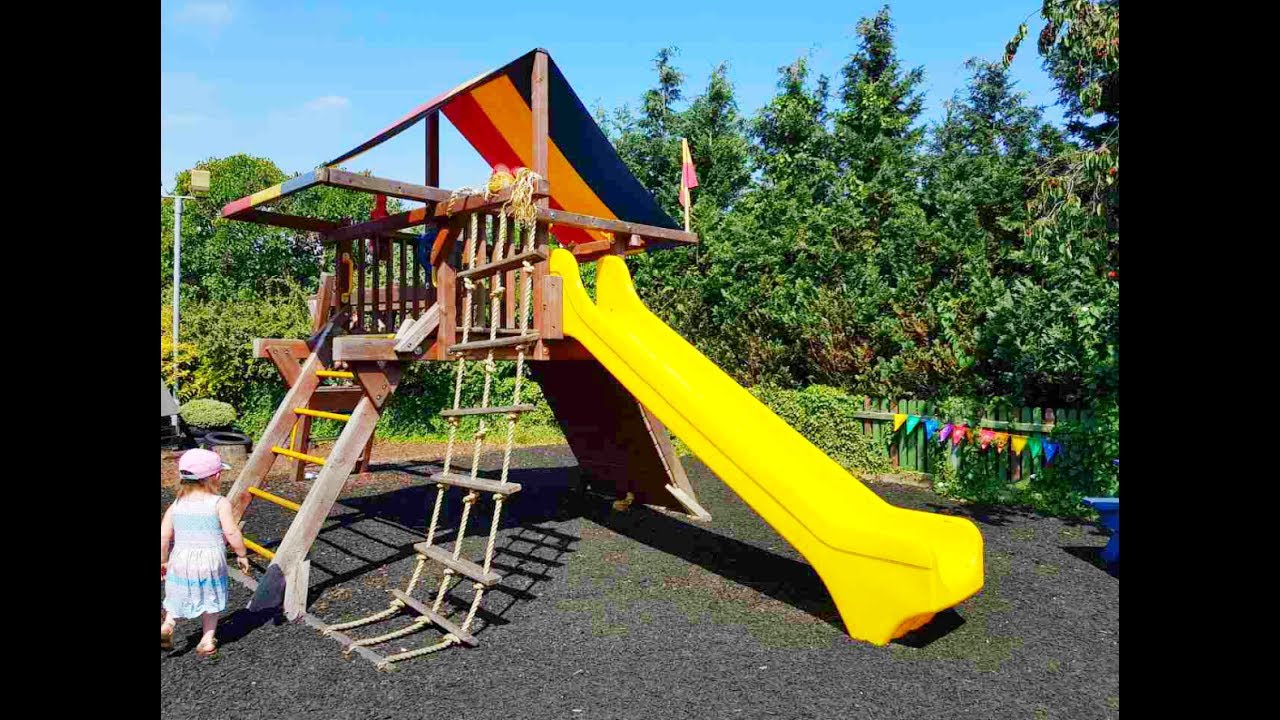 Outdoor Kids Playing in the Park Playground with Swing and Slide ...