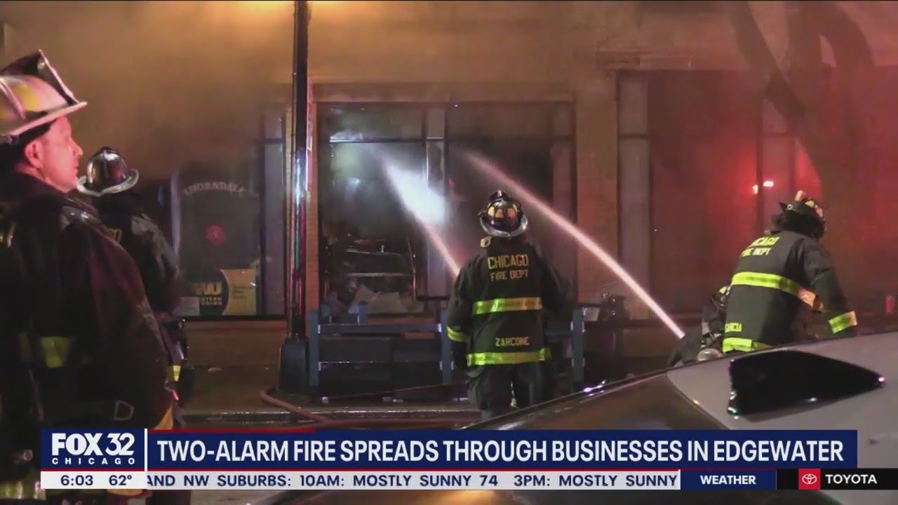 Two-alarm fire spreads through Edgewater businesses - YouTube