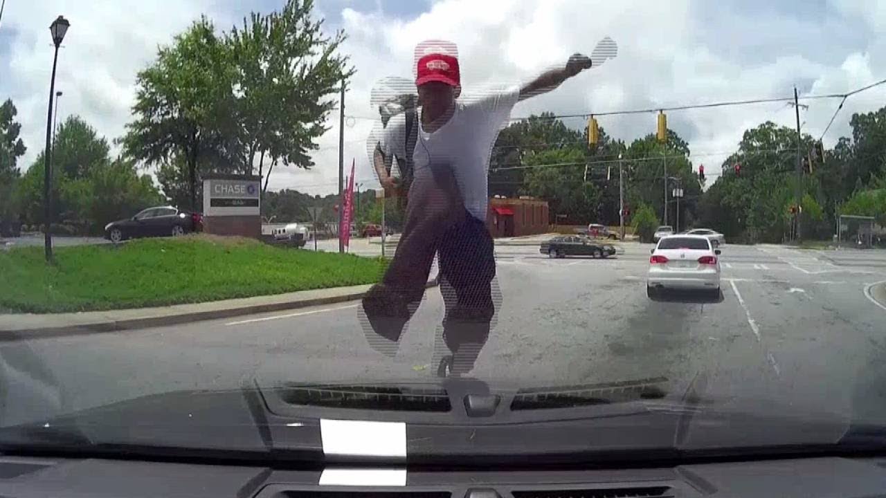 Man Jumps onto Car, Stomps Windshield - YouTube