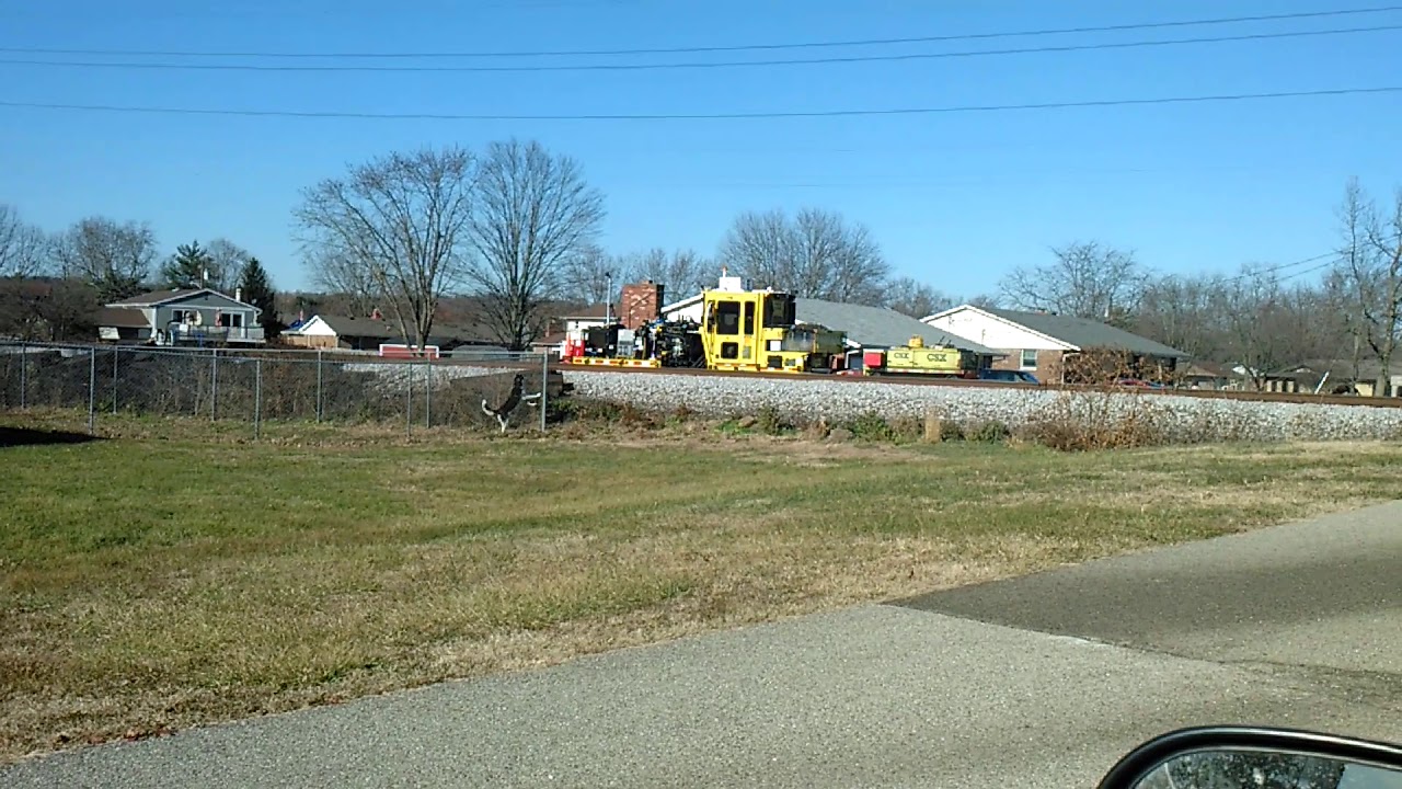 Maintenance of way equipment working on railroad ties - YouTube