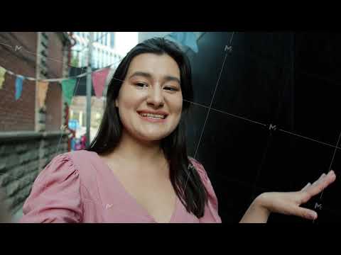 Point of view of pretty Asian girl looking at camera and talking making video call outside in the