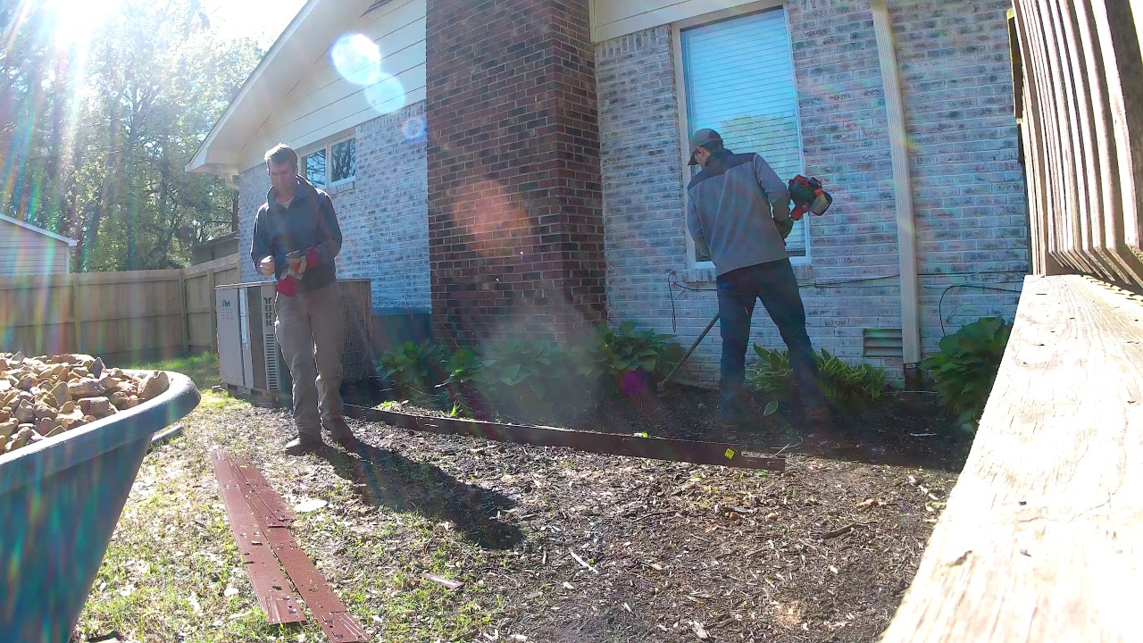 Putting down rock instead of mulch! - YouTube