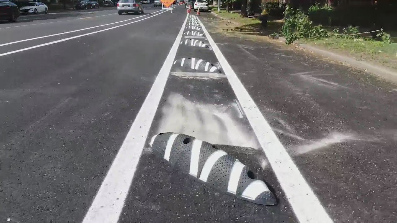 St. Louis using zebra-style delineators to help separate car and bike ...