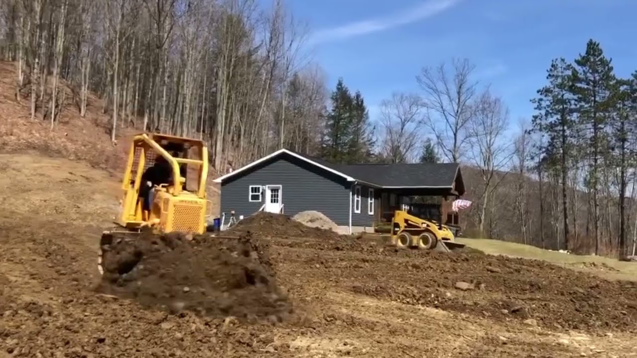 First of the year with the Dressta TD7 Dozer in the 236B CAT skid steer ...