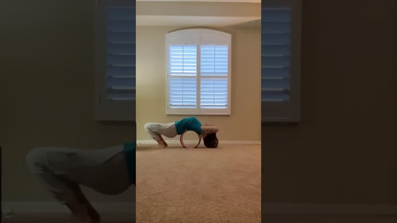 How To Use A Yoga Wheel - Roll Out Your Back! - YouTube