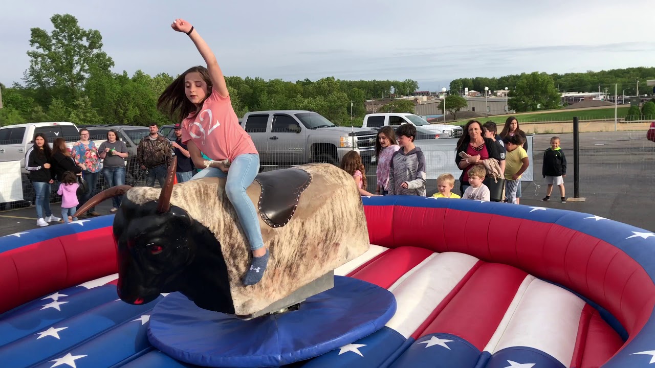 mechanical bull at a festival - YouTube