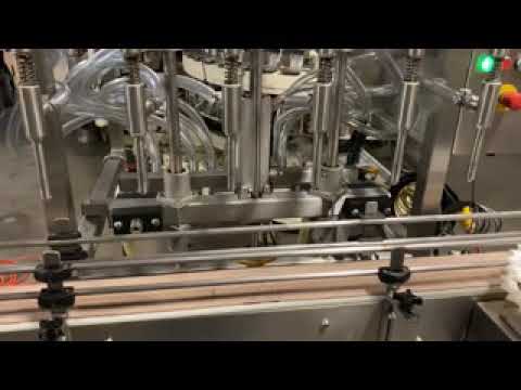 BID ON EQUIPMENT: Item 372871 - DYNAMIC PACKAGING Inline Overflow Bottle Filler with Capper ...
