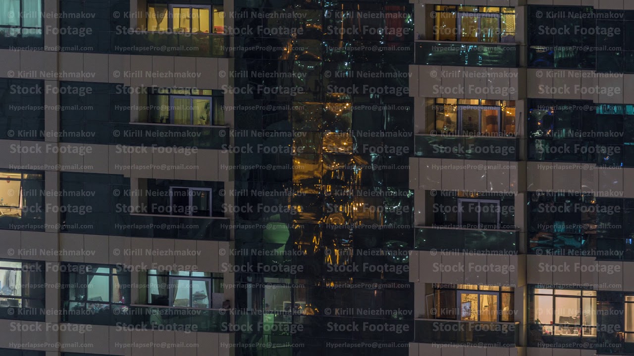 Night view of exterior apartment building timelapse. High rise ...