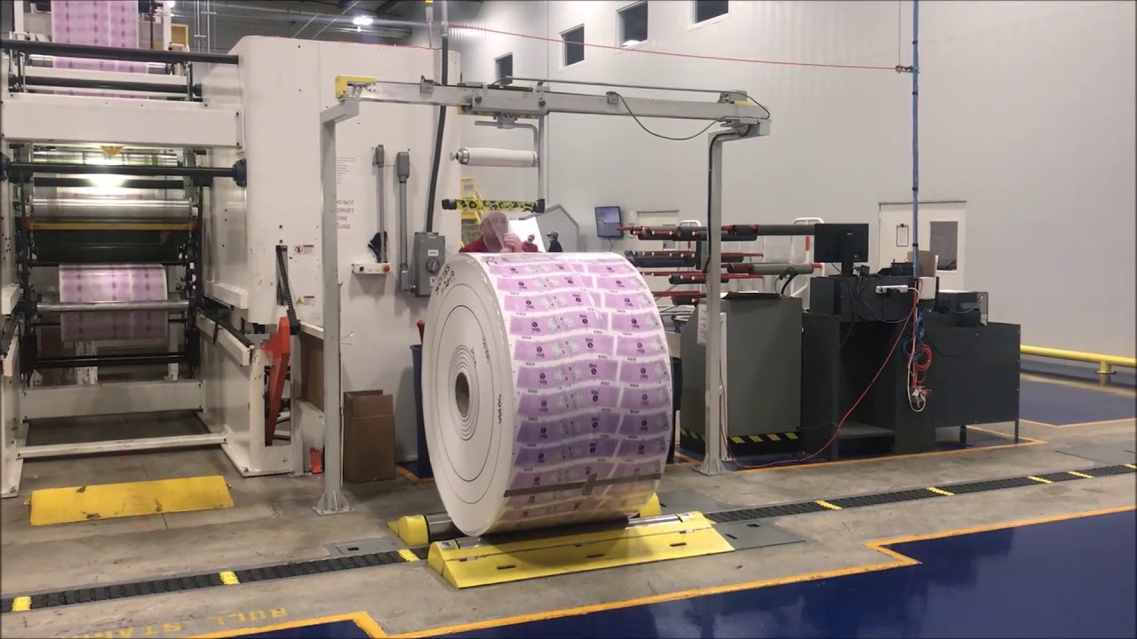 Harmax roll conveying with Harmax surface wrap station - YouTube