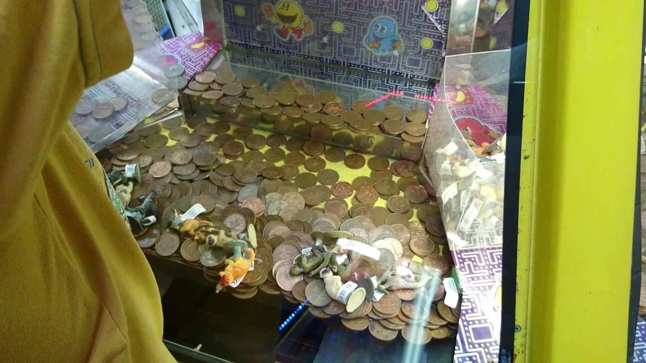 Playing The PacMan 2p Coin Pusher Machine In The Arcades - YouTube