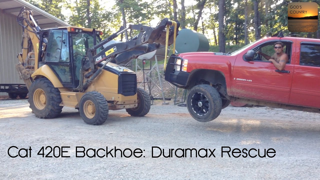 Cat 420E Backhoe Rescues Duramax - YouTube
