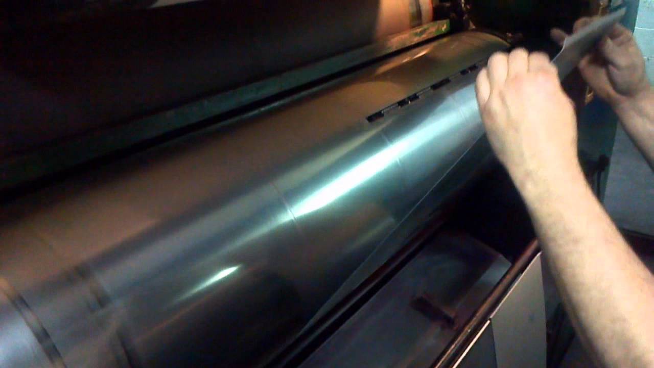 Newspaper printing plate loading on press cylinder. - YouTube