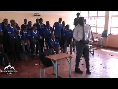 Teacher and pupils sing and dace Mbo by chanda na kay