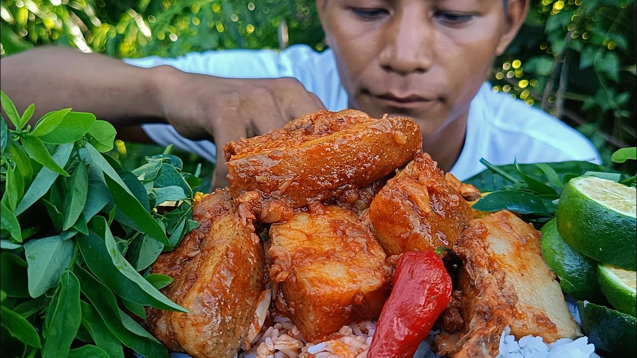 Eating tender pork cook with axone + one of my favourite green leaves ...