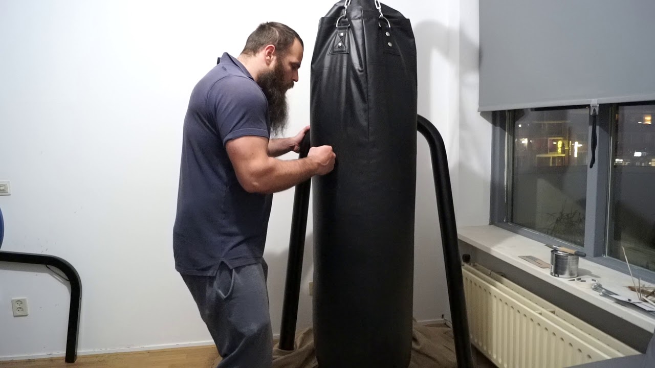 One right hook power punch against the heavybag while holding the frame ...