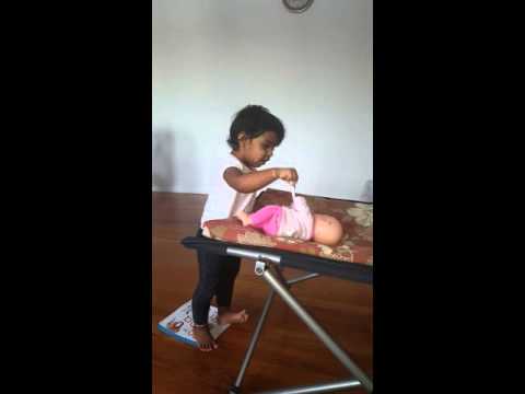 Aadya feeding to her doll