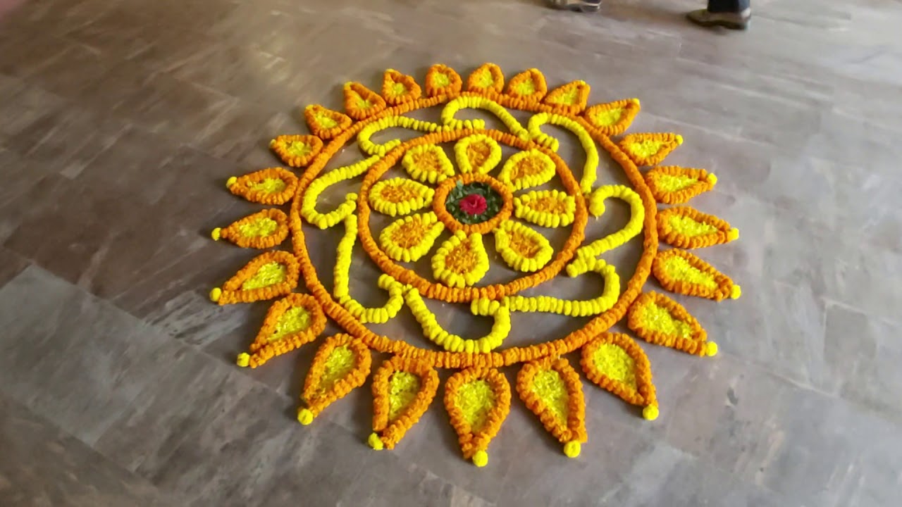 Rangoli with marigold flower at agriculture exhibition diy muggulu ...