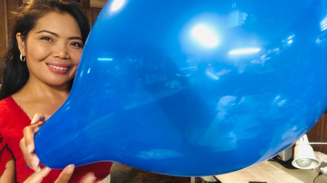 Blowing Blue balloon Inflating and Deflating and scratching and rubbing ...