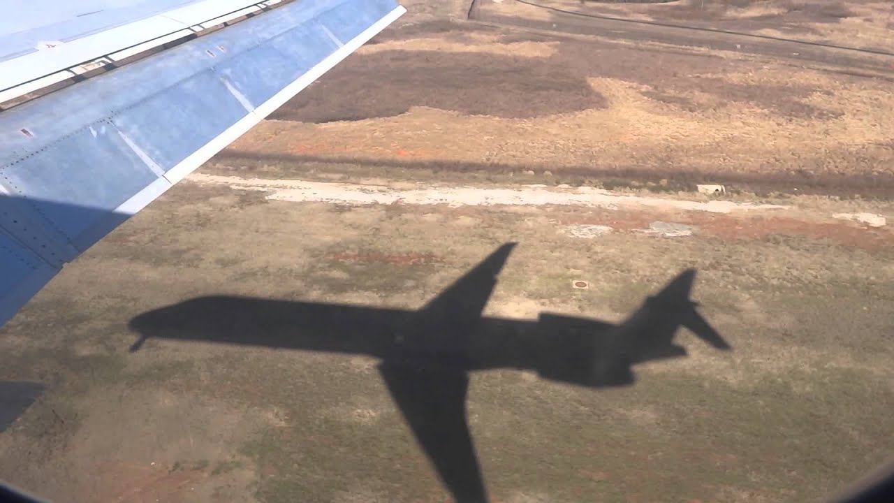 Big Airplane Shadow Flies over City, Lands - YouTube
