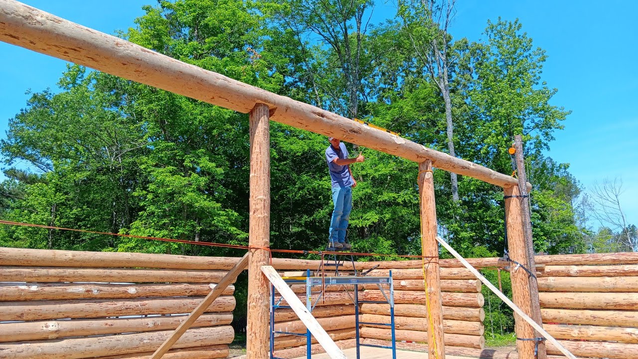 setting the log ridge beam, cabin building in the woods - YouTube